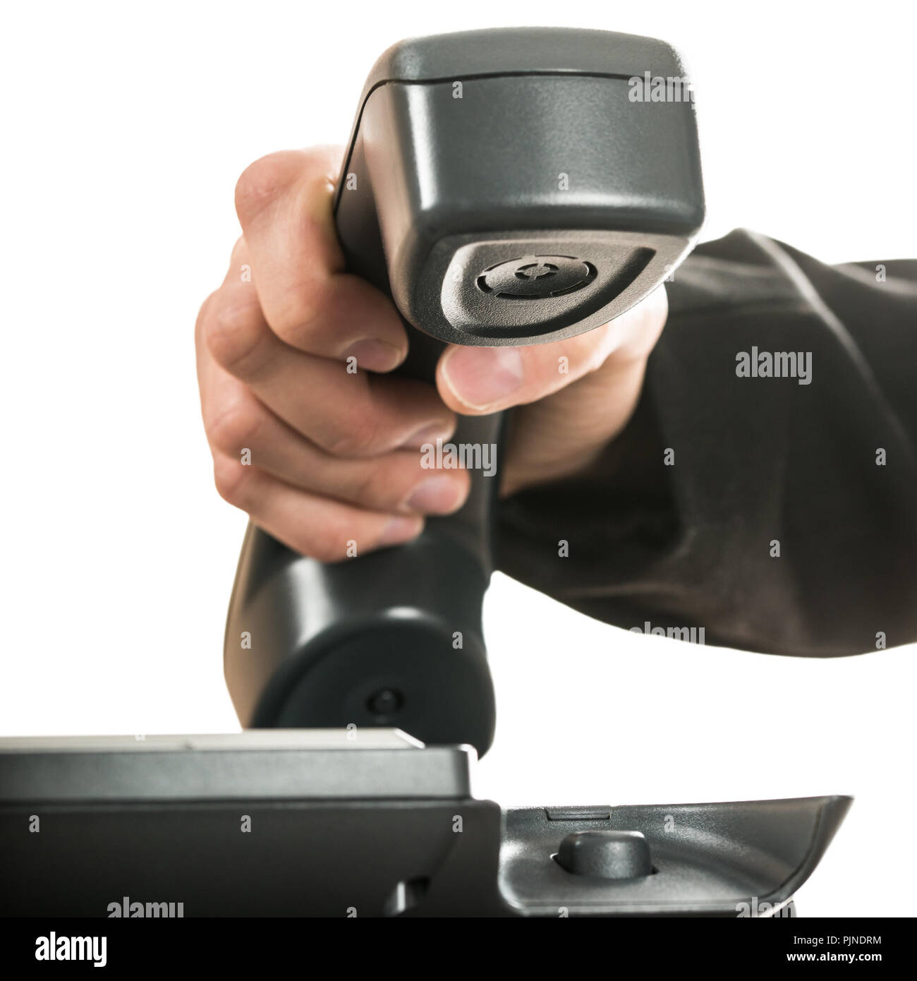 Closeup of a businessman hand hanging up or answering a telephone call ...