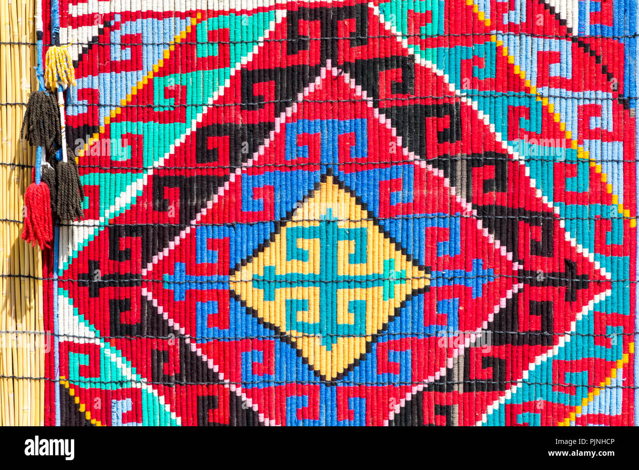 Market stalls with decorative tribal textile with colourful pattern ...