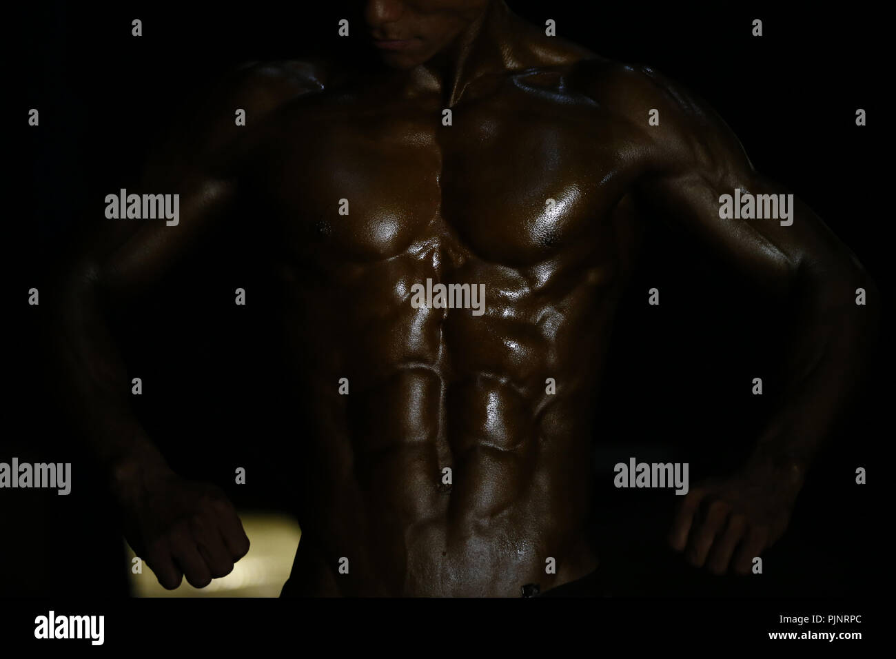 Kathmandu, Nepal. 8th Sep, 2018. A Nepalese body builder flex backstage ...