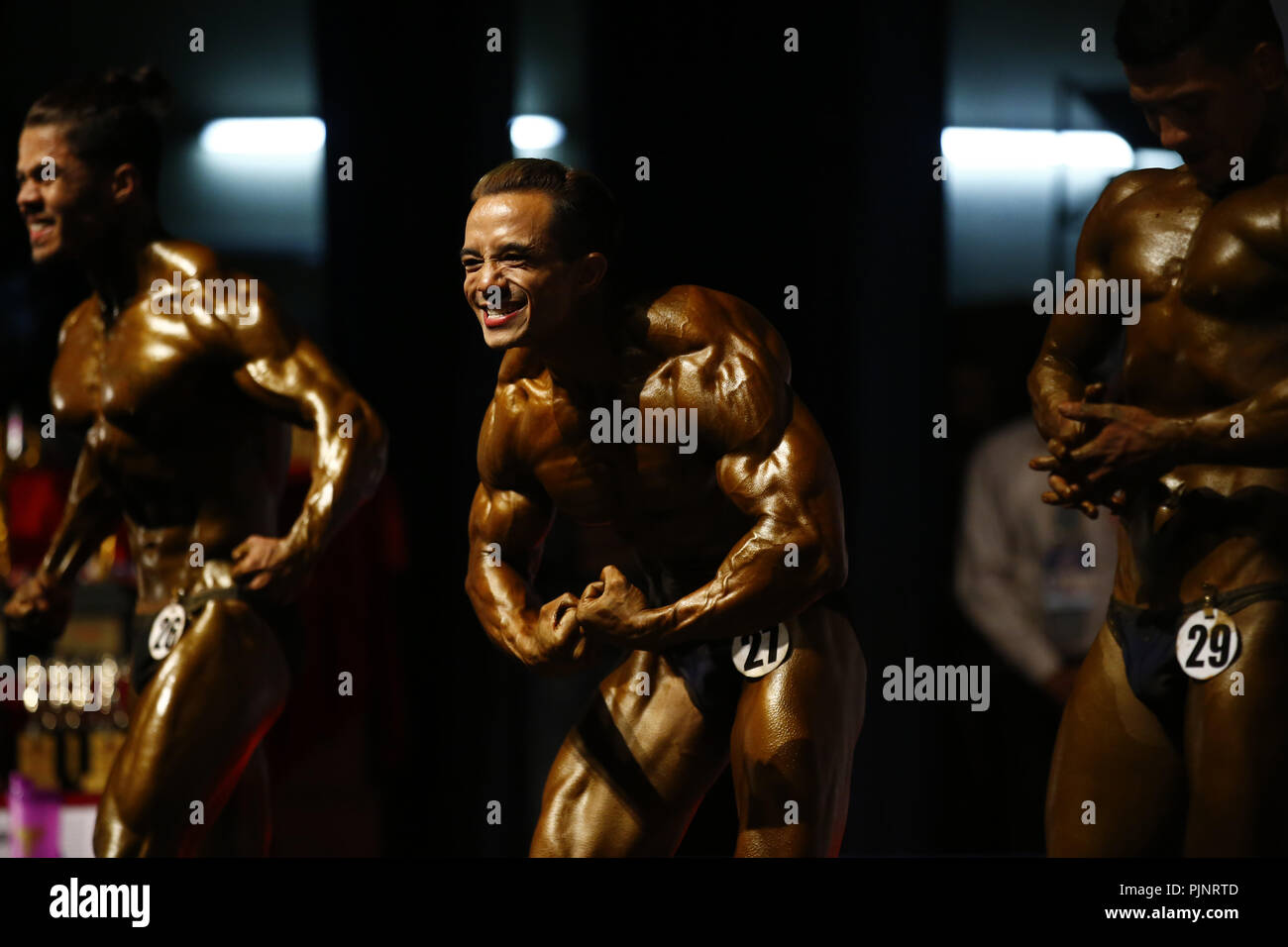 Kathmandu, Nepal. 8th Sep, 2018. Nepalese body builders flex on stage ...
