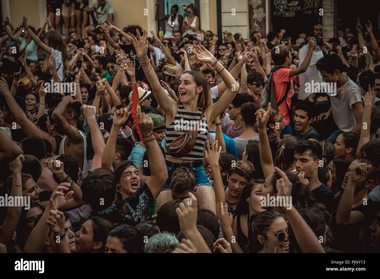 Mahon, Spain. 8 September, 2018: A girl dances in between the cheering ...