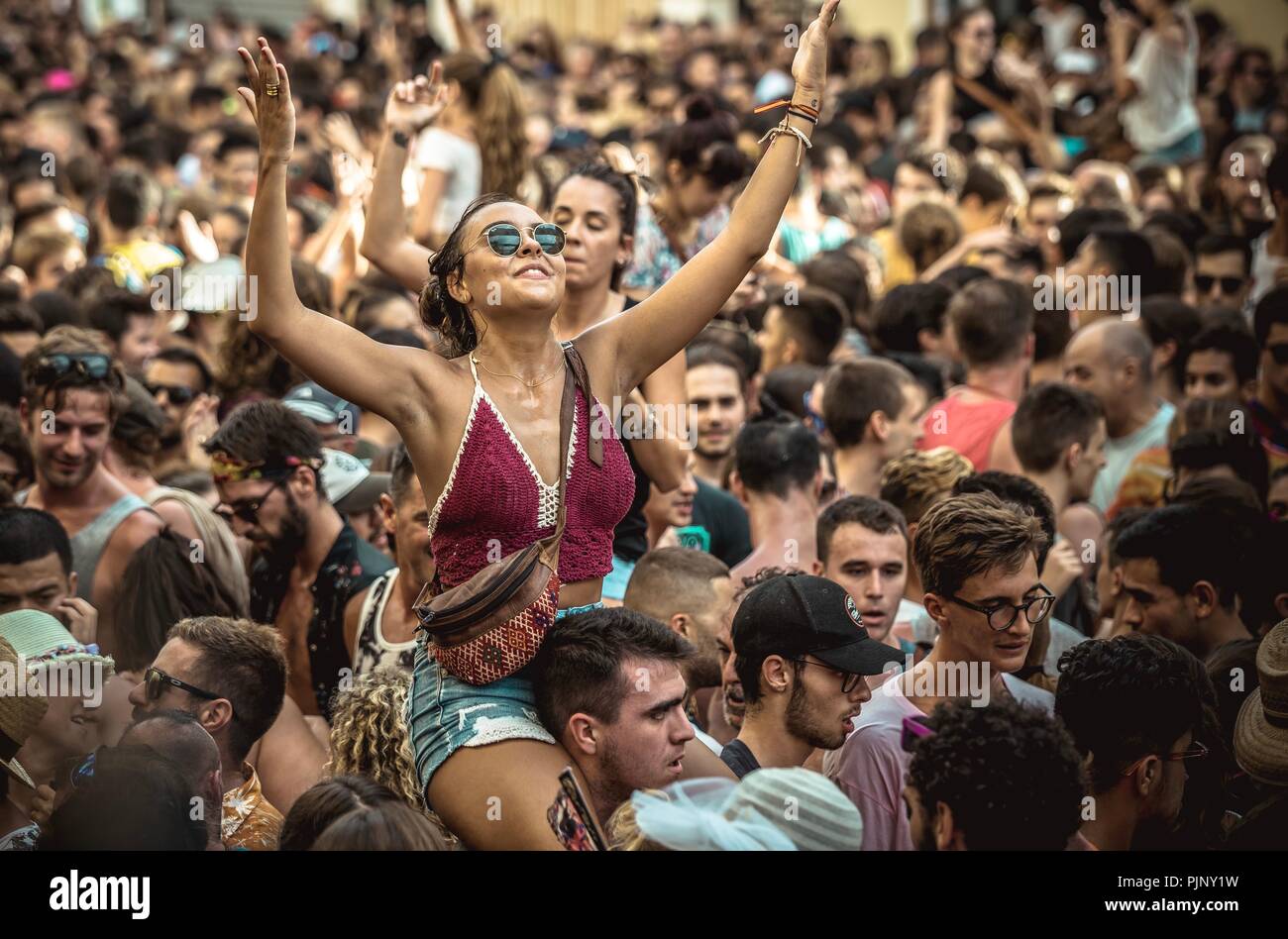 Mahon, Spain. 8 September, 2018: A girl dances in between the cheering ...