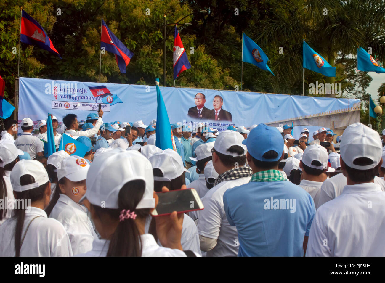 People are gathered to listen to a speech by Prime Minister Hun Sen's ...