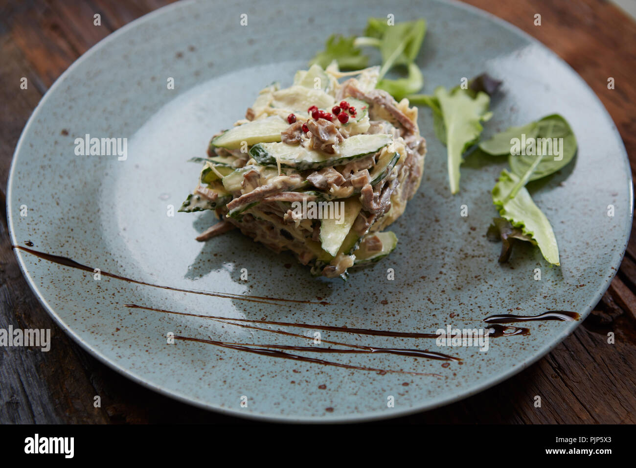 Boiled beef tongue, marinated onion and peas salad with mayonnaise ...