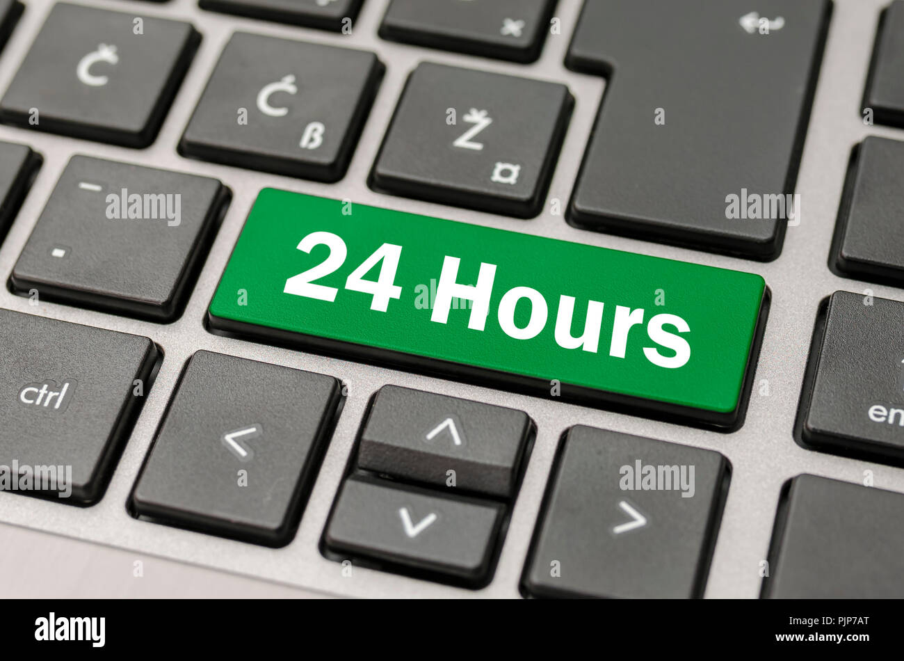 Green computer button with 24 Hours sign Stock Photo - Alamy