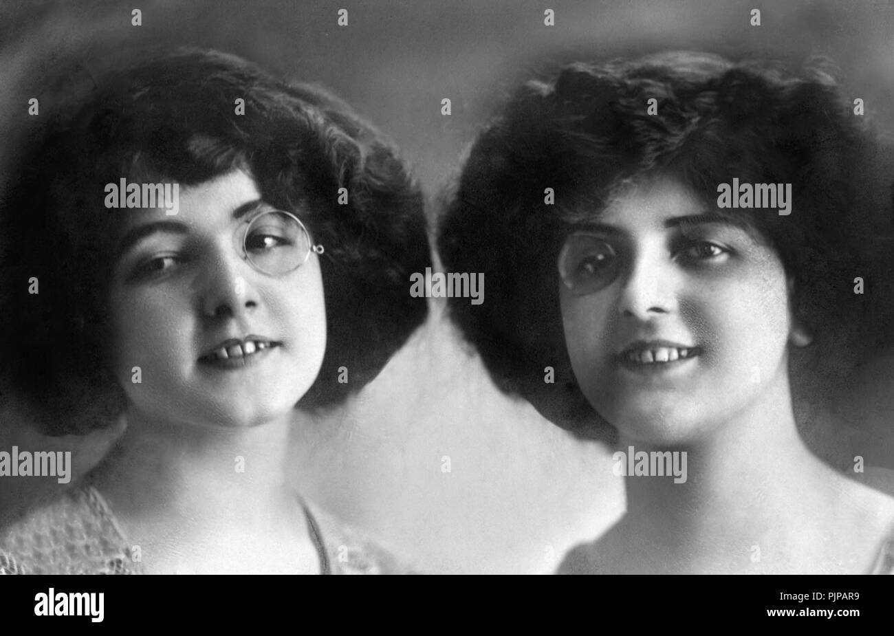 Sisters, twins with monocle, 1910s, Germany Stock Photo - Alamy