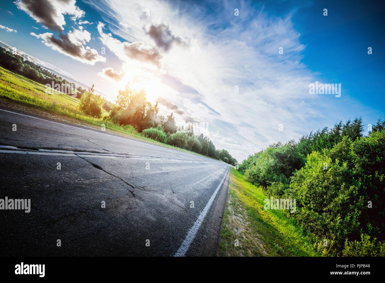 Road way forward direction. Summer evening landscape Stock Photo - Alamy