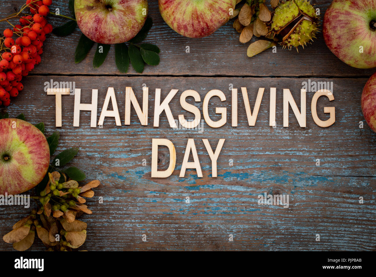 Happy Thanksgiving Day - text with Autumn background from fallen leaves ...