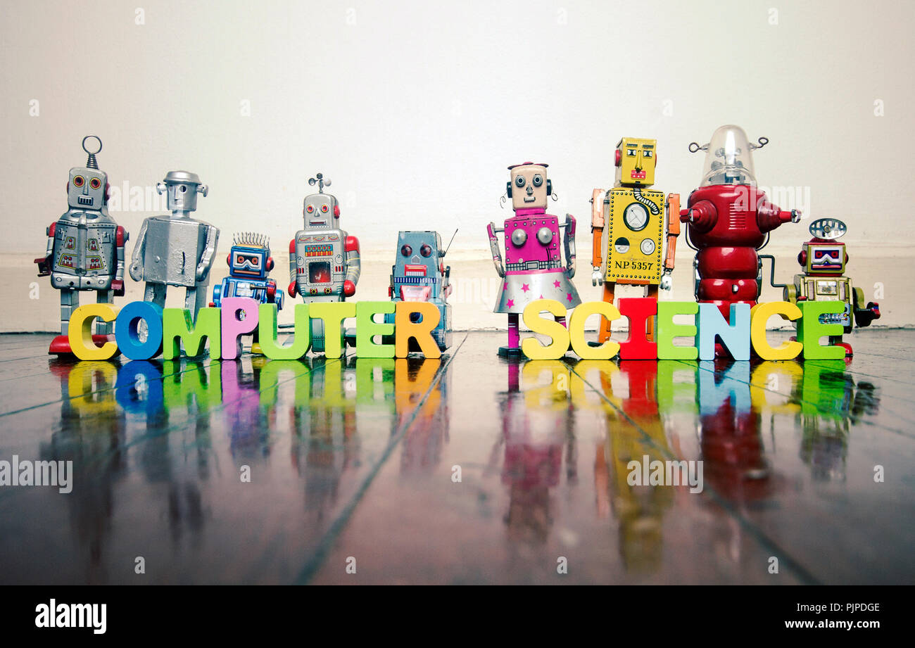 COMPUTER SCIENCE wooden letters and retro robot toys on a wooden floor ...