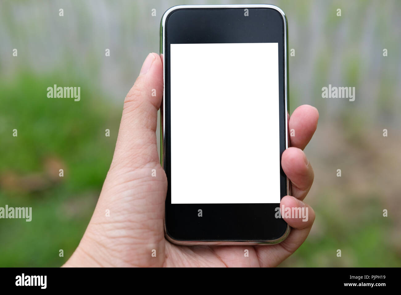 agronomist farmer using smart phone to monitor humidity, pH ...