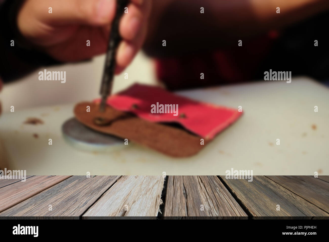 craftsman pinching button on leather bag. handmade DIY handicraft ...