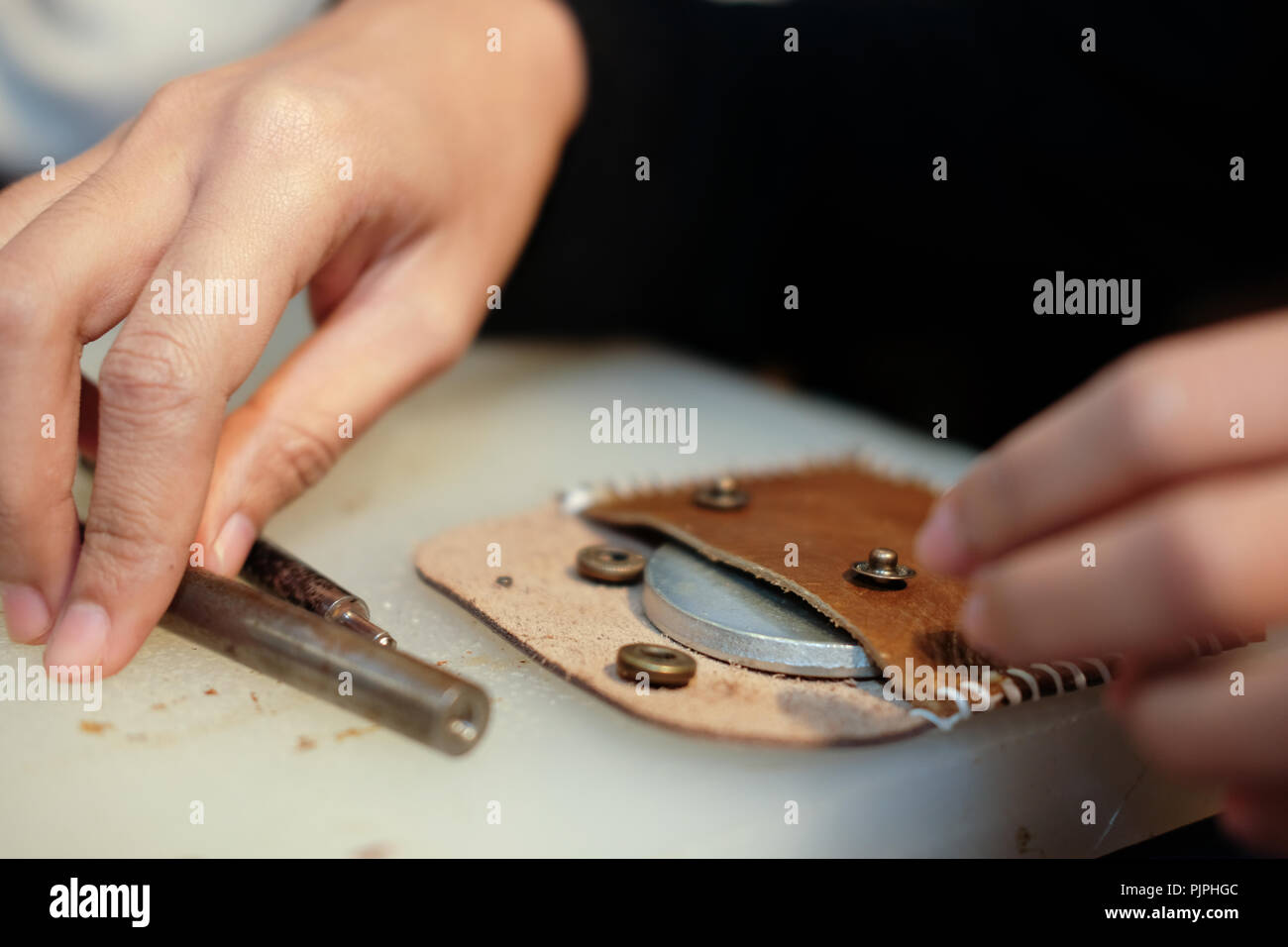 craftsman making leather bag. handmade DIY handicraft workshop Stock ...