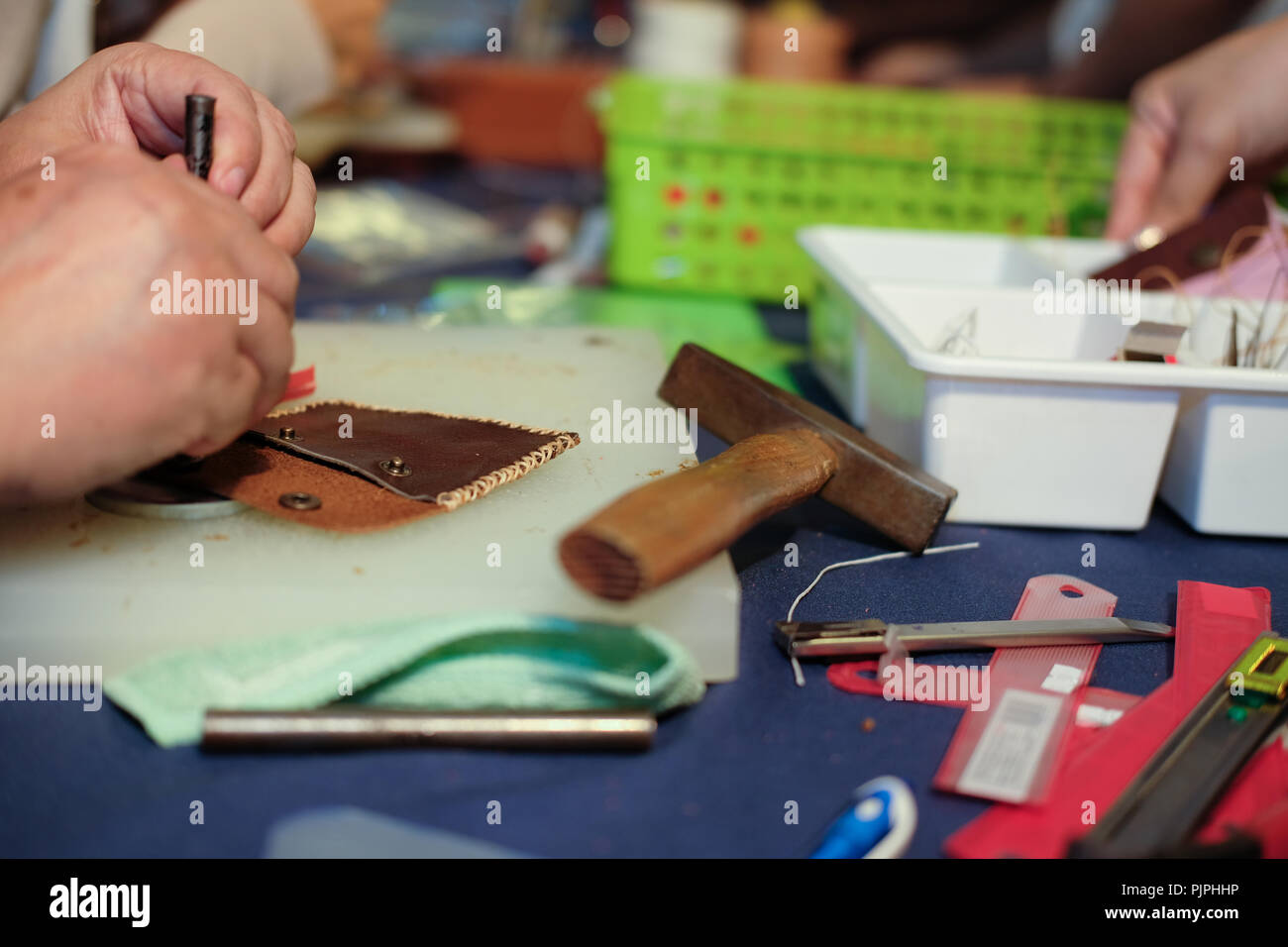 craftsman making leather bag. handmade DIY handicraft workshop Stock ...