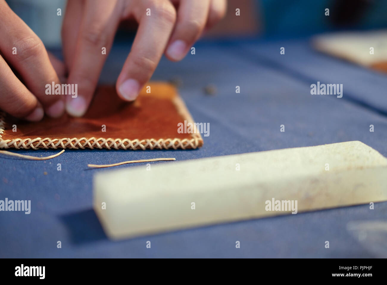 craftsman making leather bag. handmade DIY handicraft workshop Stock ...