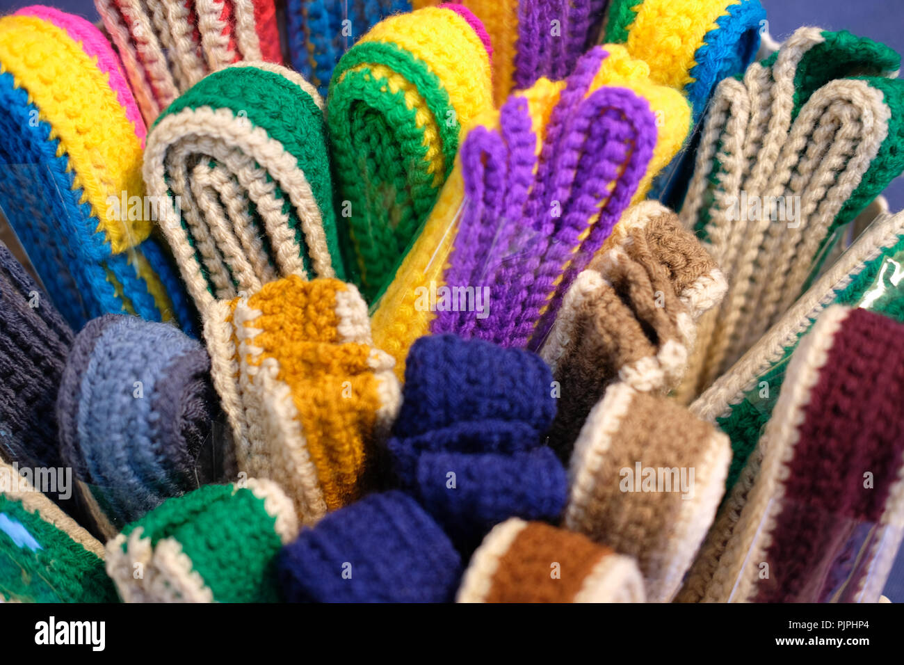 colorful knitted belt. knitting fabric strap. handmade handicraft ...