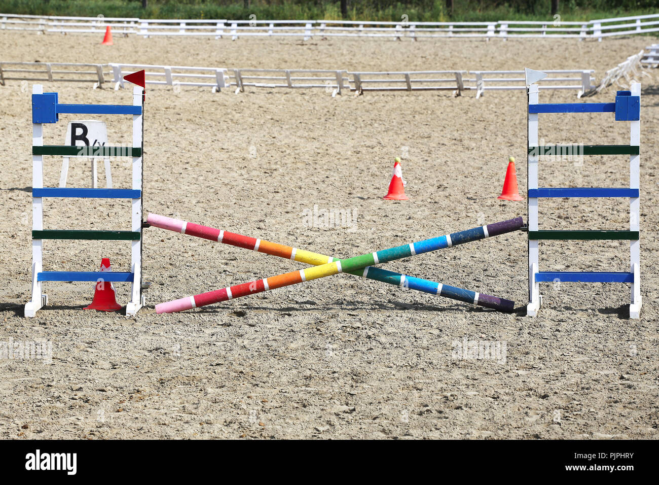 Multi colored image of show jumping poles at the show jumping arena ...