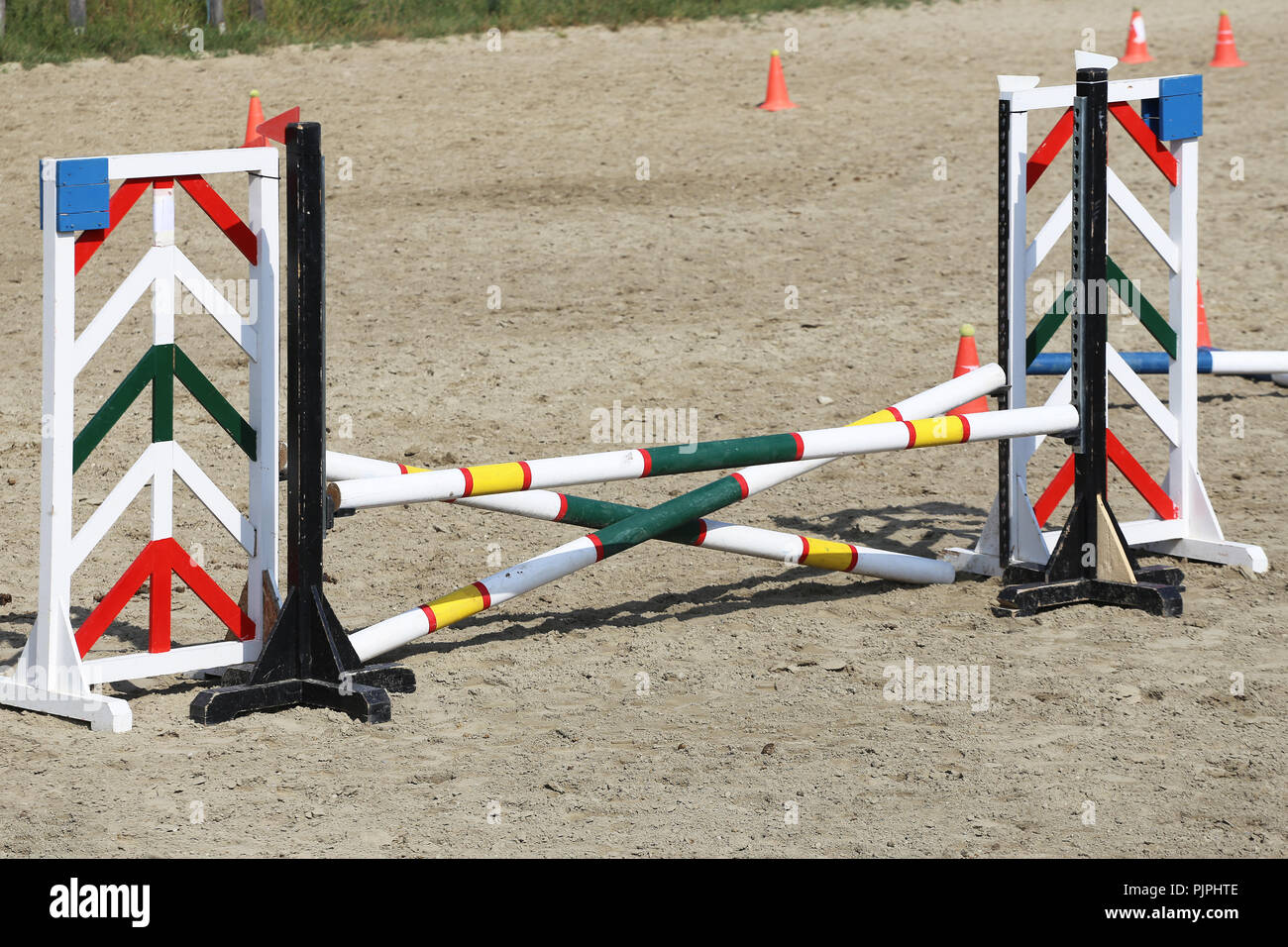 Multi colored image of show jumping poles at the show jumping arena ...