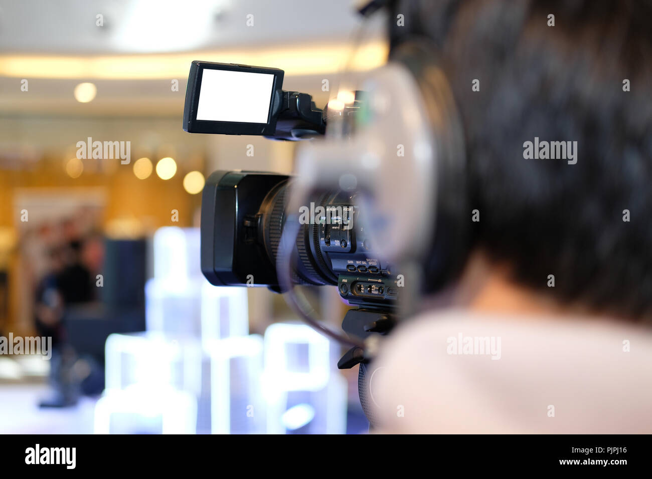 professional video production camera recording live event on stage ...