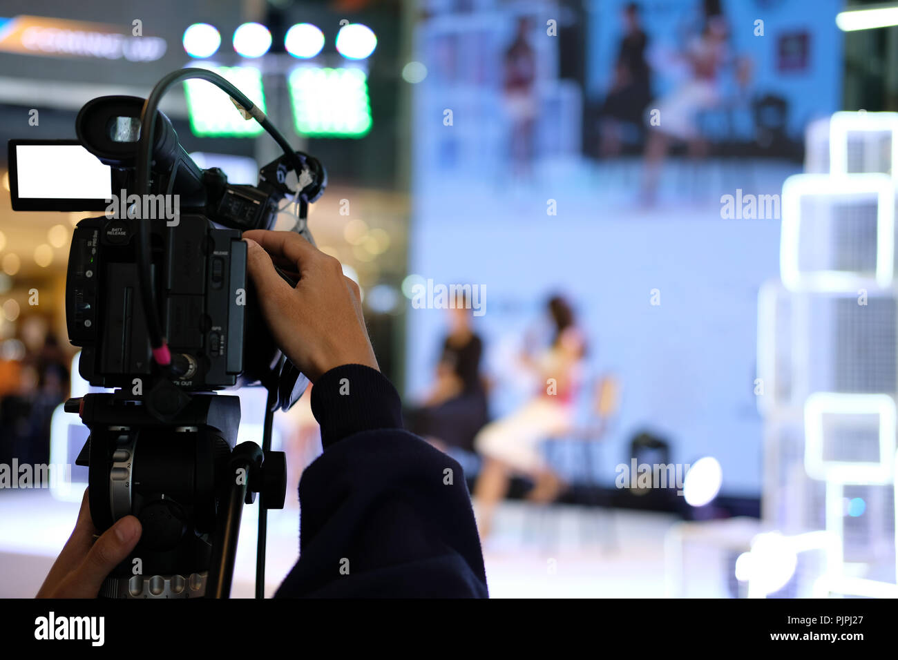 professional video production camera recording live event on stage ...