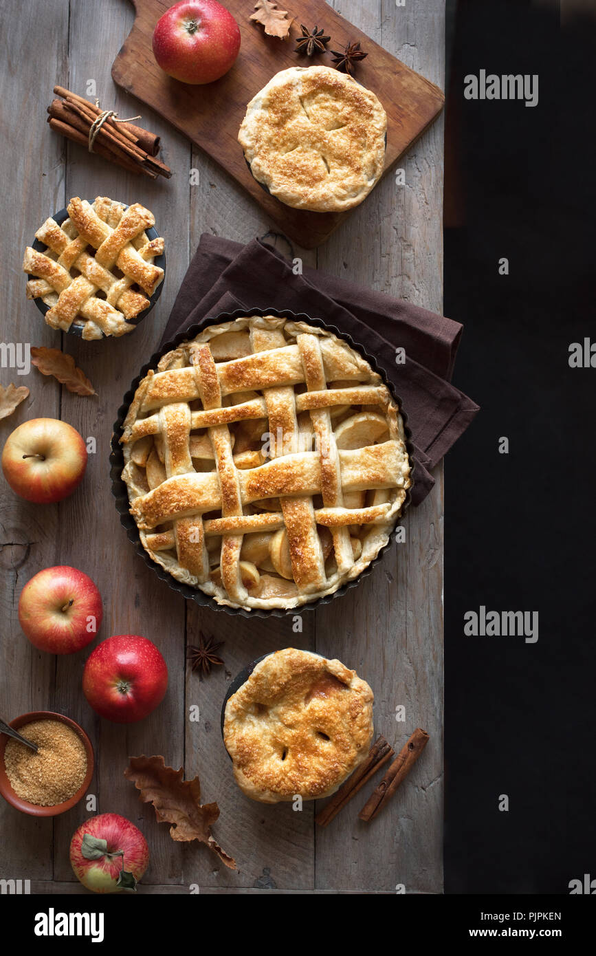 Homemade Apple Pies on rustic background, top view. Classic autumn ...