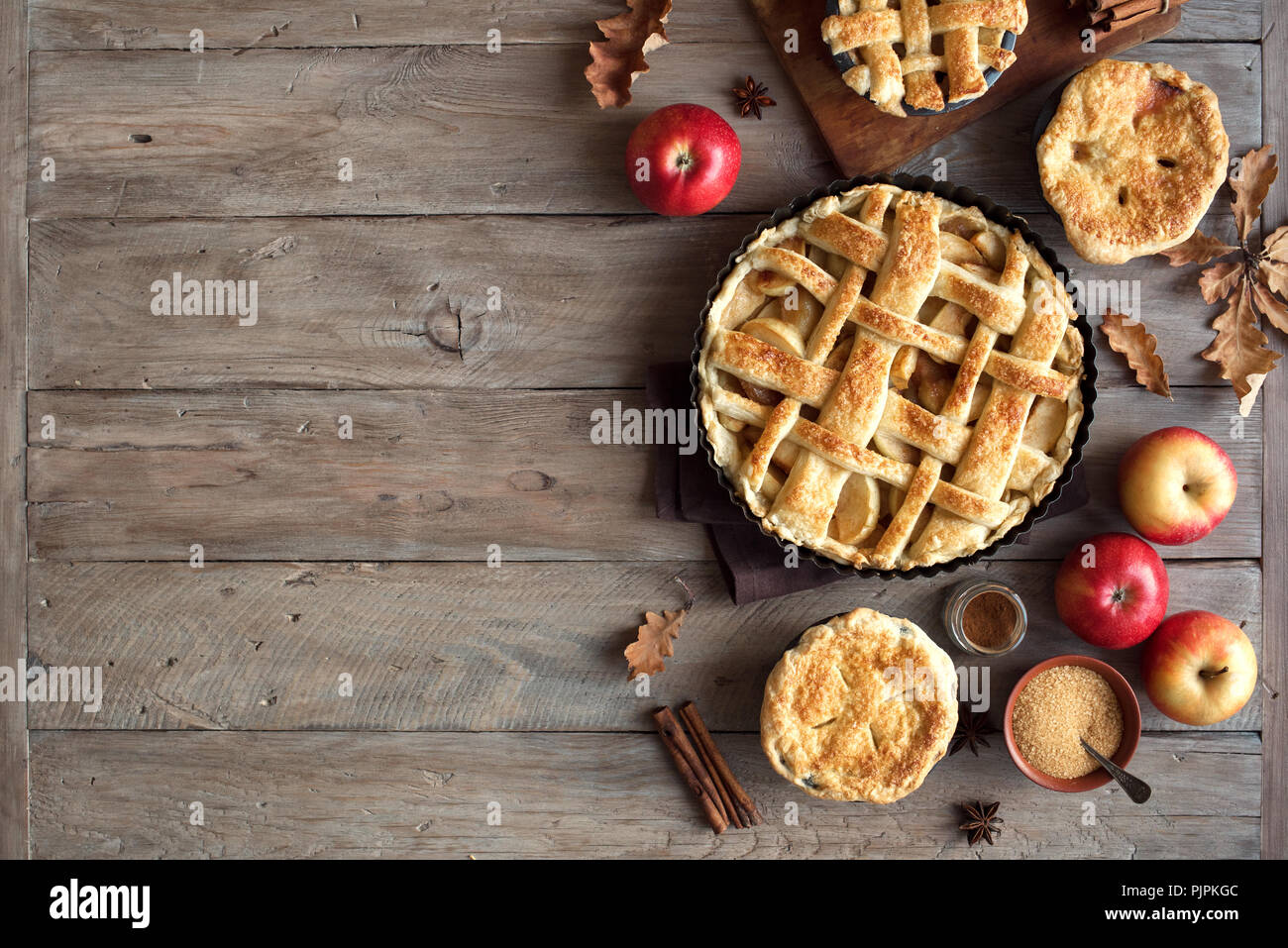 Homemade Apple Pies on rustic background, top view, copy space. Classic ...