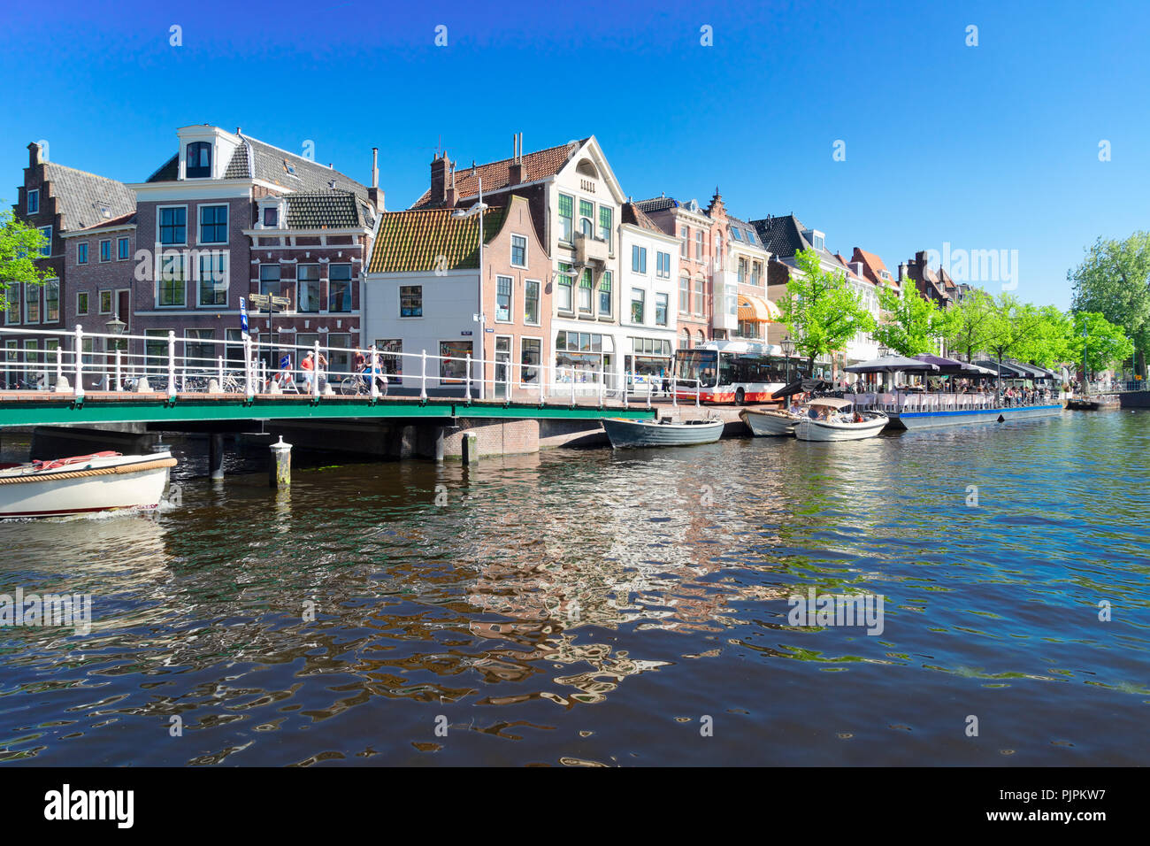 bridge and canals in old town with historical houses of Leiden ...