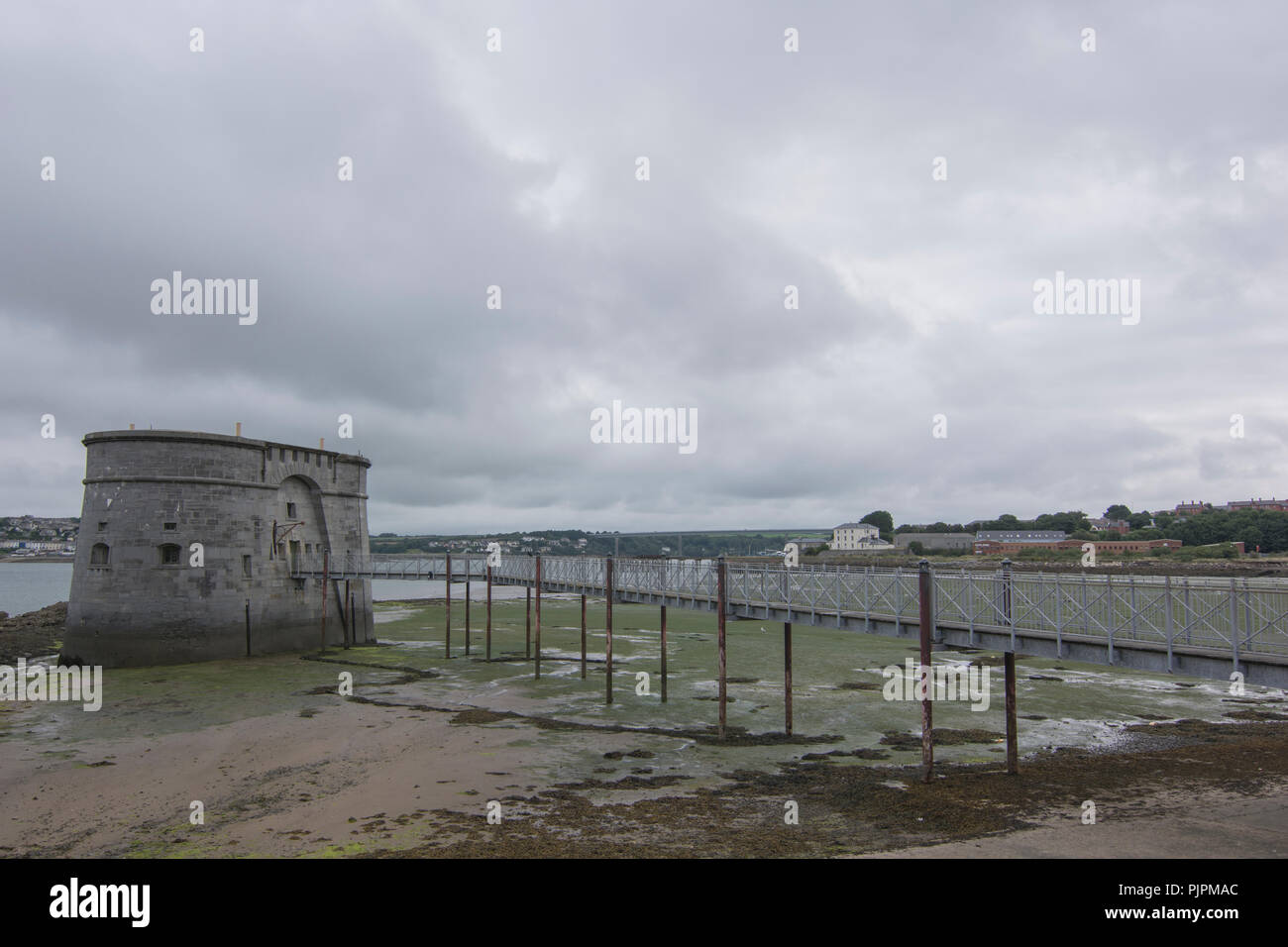 pembroke coastal gun tower Stock Photo - Alamy