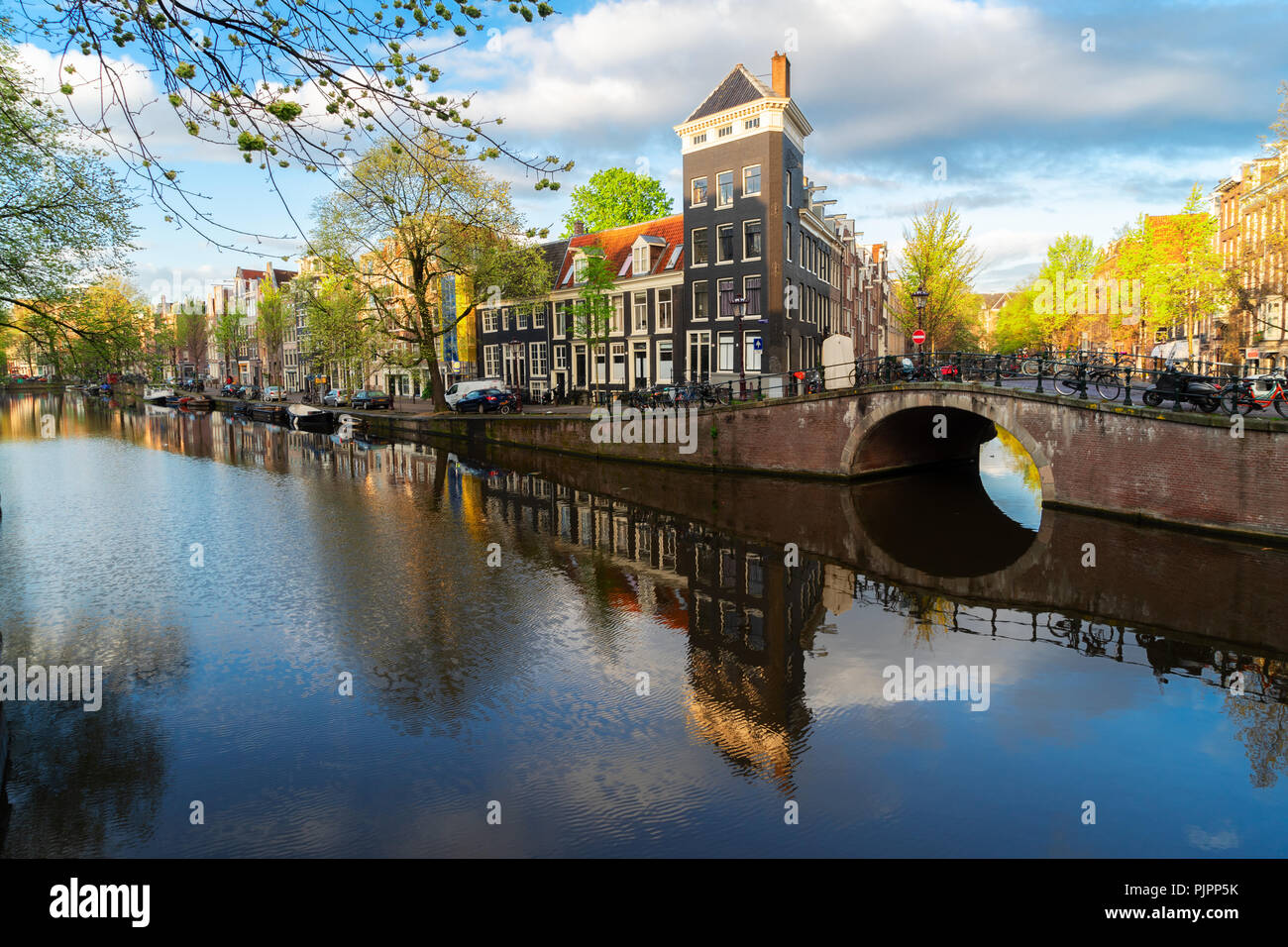 Dutch city scenery with canal and mirror reflections, Amstardam ...
