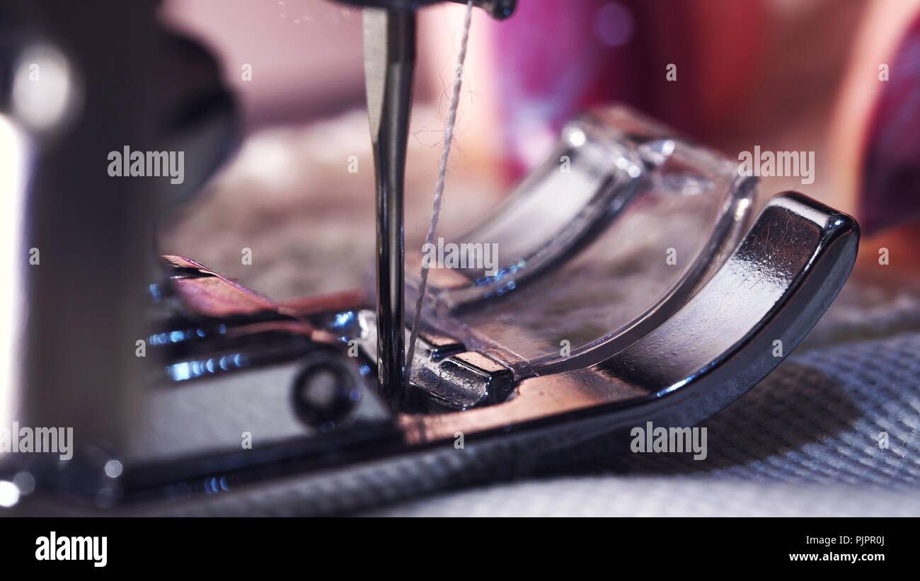 Close up of sewing machine showing process. Item of clothing, vintage ...