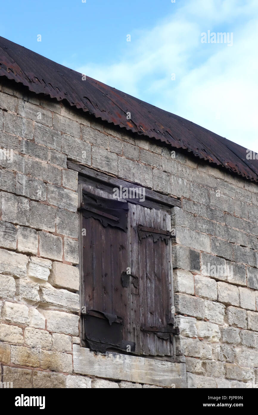 old wooden doors in a 17th Century Barn on the Sandbeck Park Estate a ...