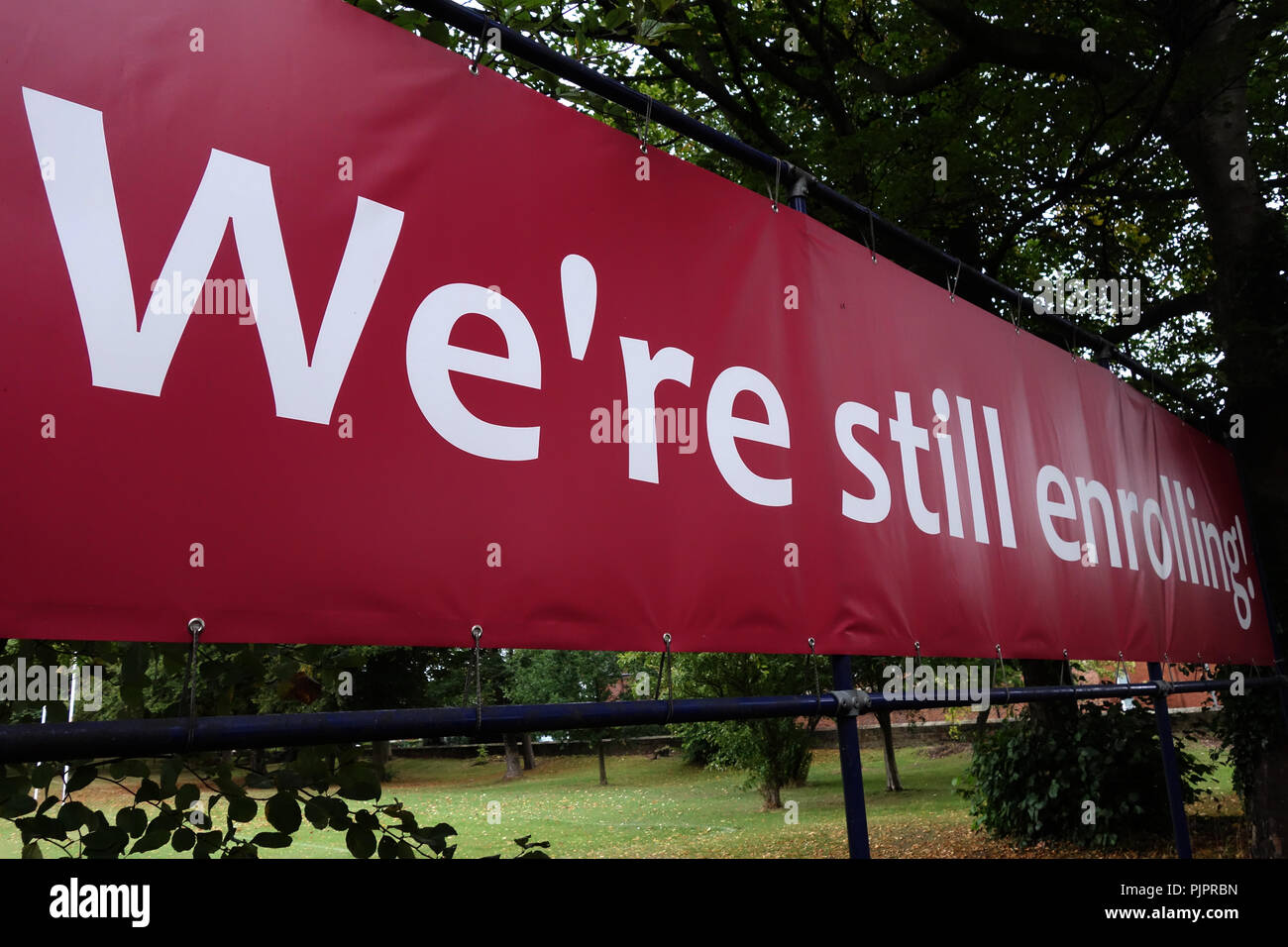 Were still enrolling sign at thomas rotherham college hi-res stock ...