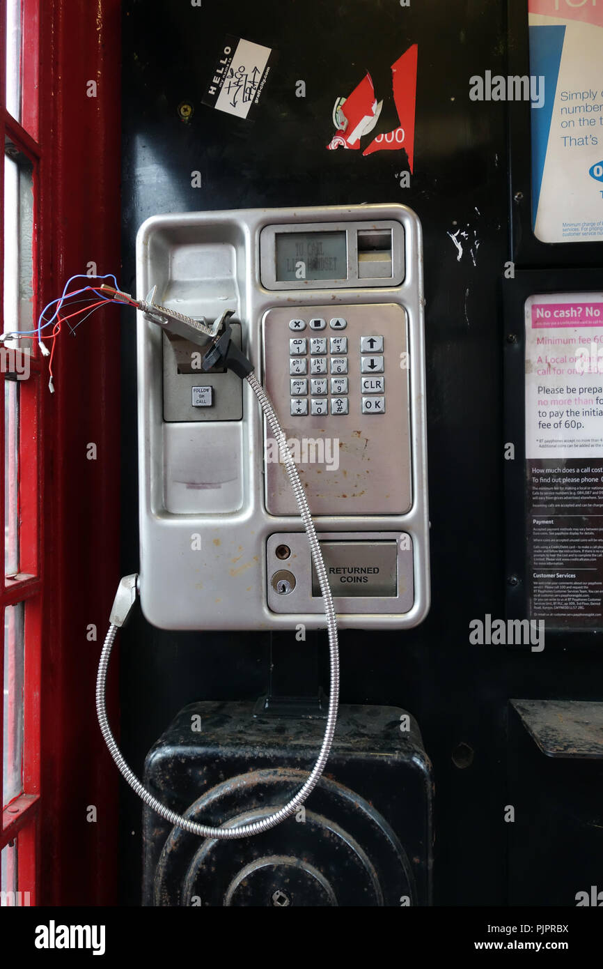 Handset missing in Vandalised phone box interior Stock Photo - Alamy