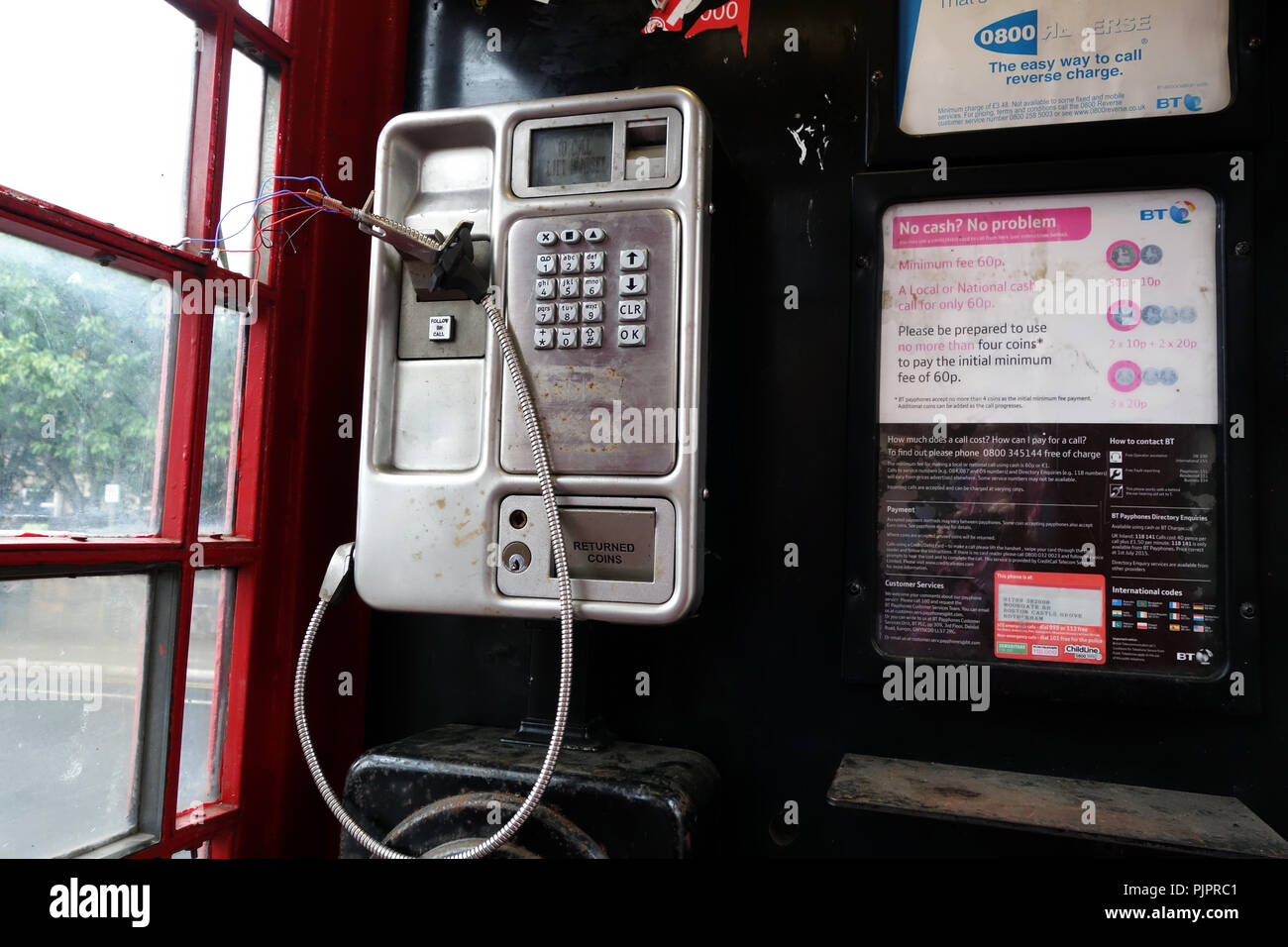 Handset missing in Vandalised phone box interior Stock Photo - Alamy