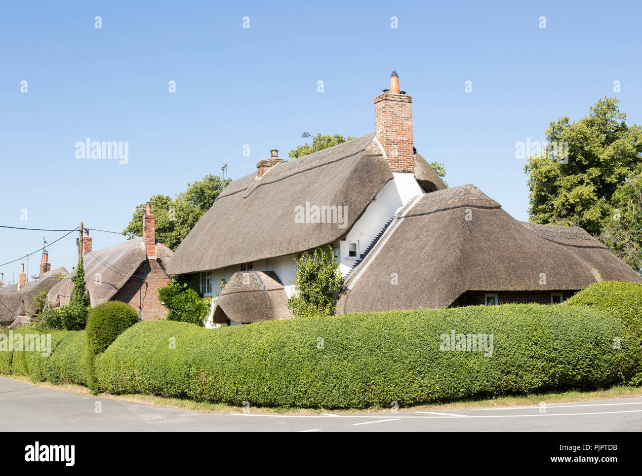 Attractive thatched village houses at Wilcot, Pewsey Vale, Wiltshire ...