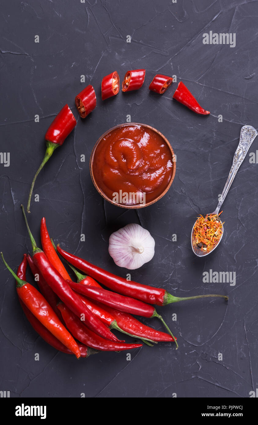 Red spicy chili pepper on dark background Stock Photo - Alamy