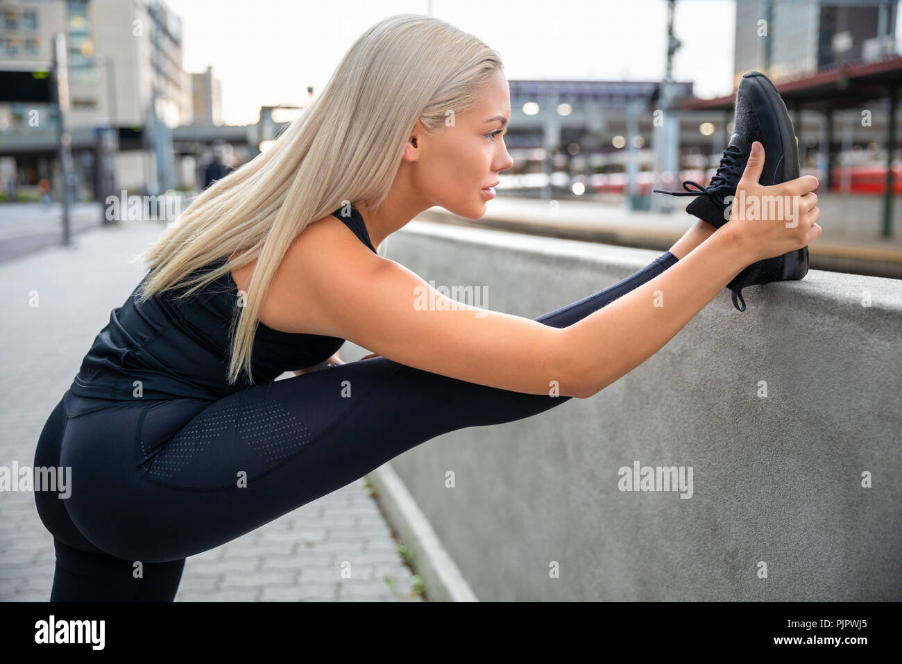 Leaning on railing woman hi-res stock photography and images - Alamy