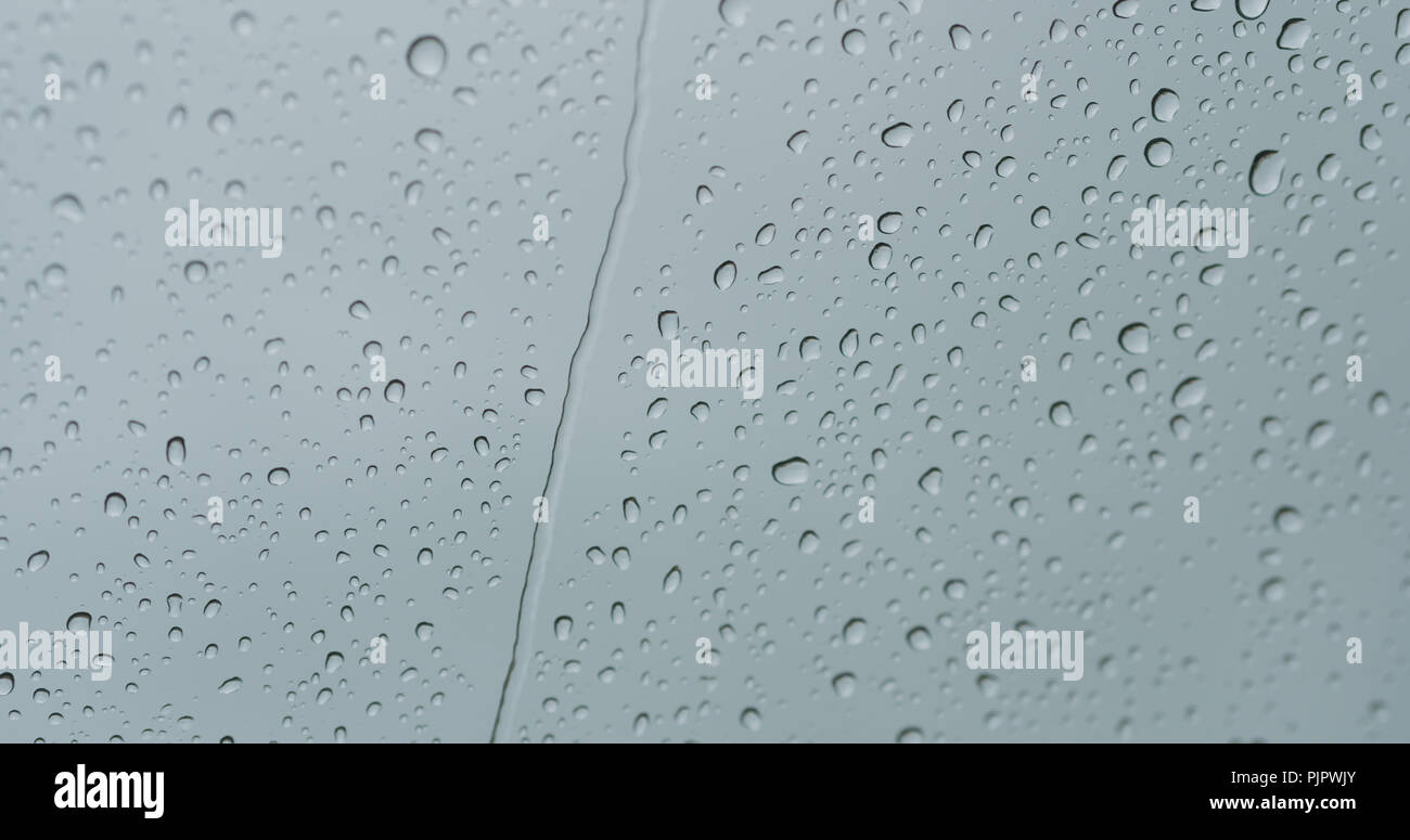 water drop sliding from windscreen, wide photo Stock Photo - Alamy