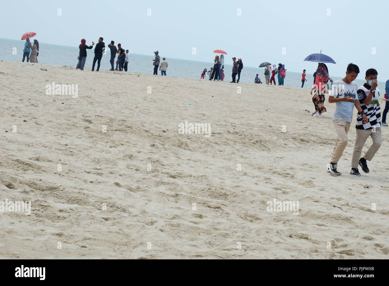 group of people in the beach Stock Photo - Alamy