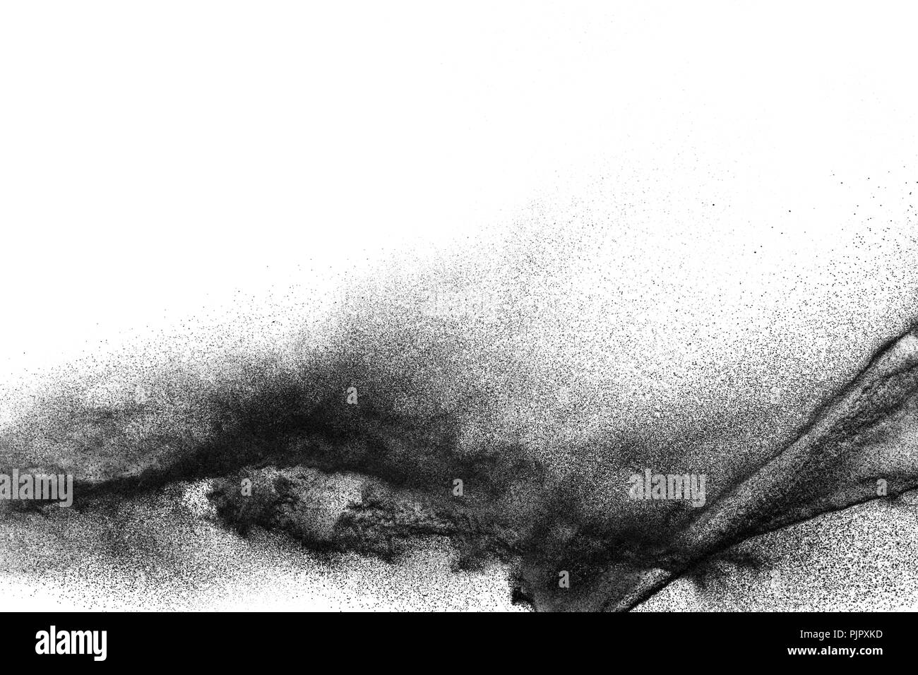 Black particles splattered on white background. Black powder dust ...