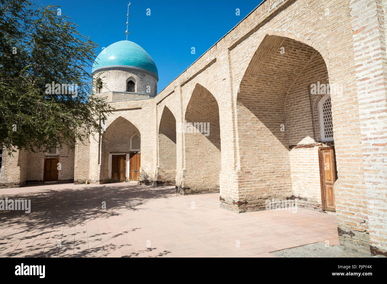 The facade of the Norbut-biy Madrasah in Kokand, Uzbekistan Stock Photo ...