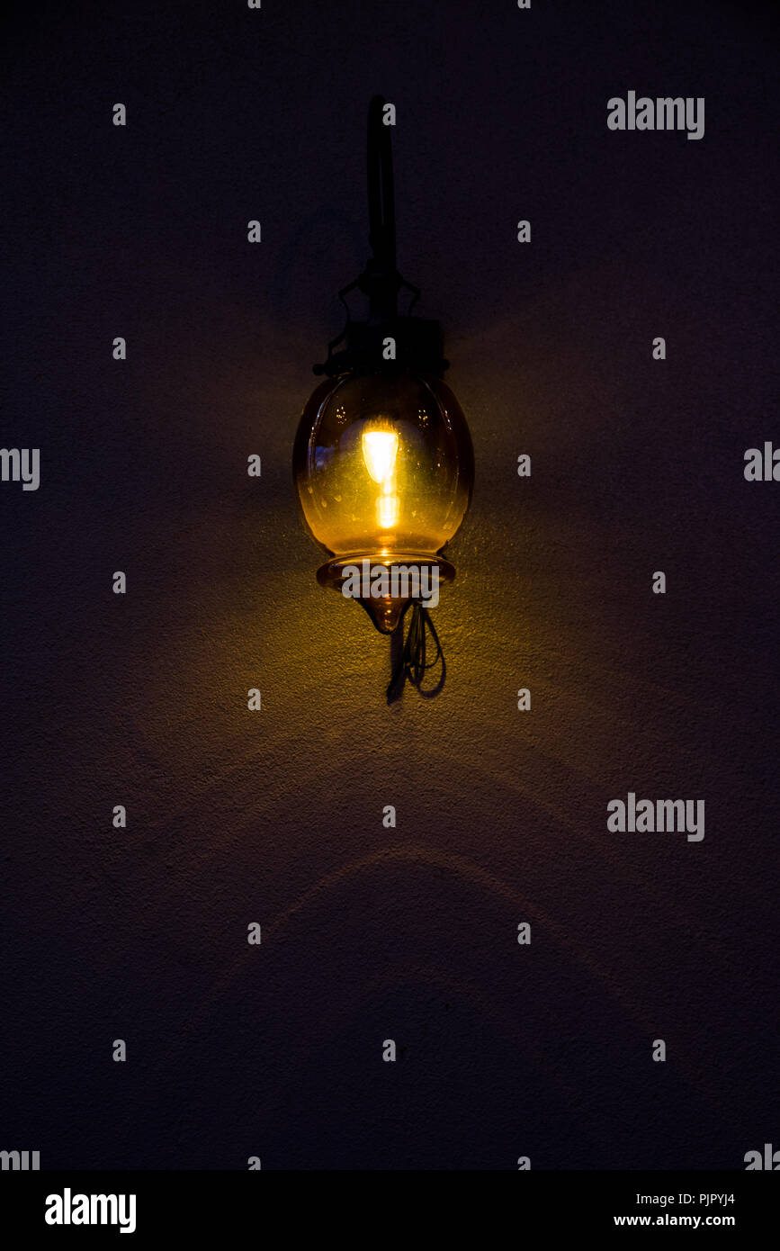 Decorative wall mounted lamp in golden color Stock Photo - Alamy