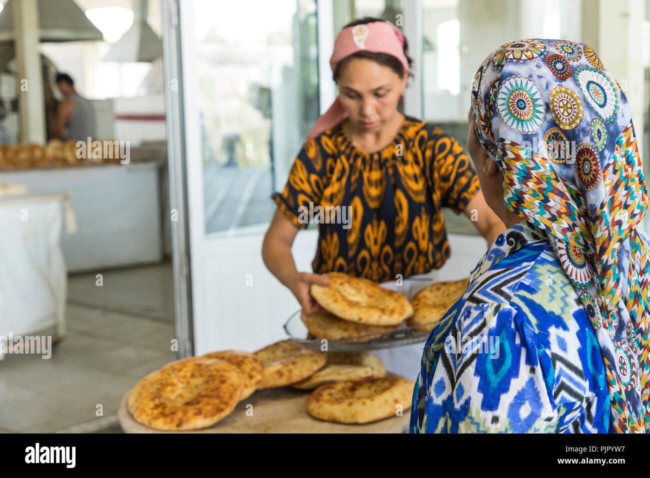 TASHKENT UZBEKISTAN - AUGUST 22 2018: National plain uzbek bread sold ...