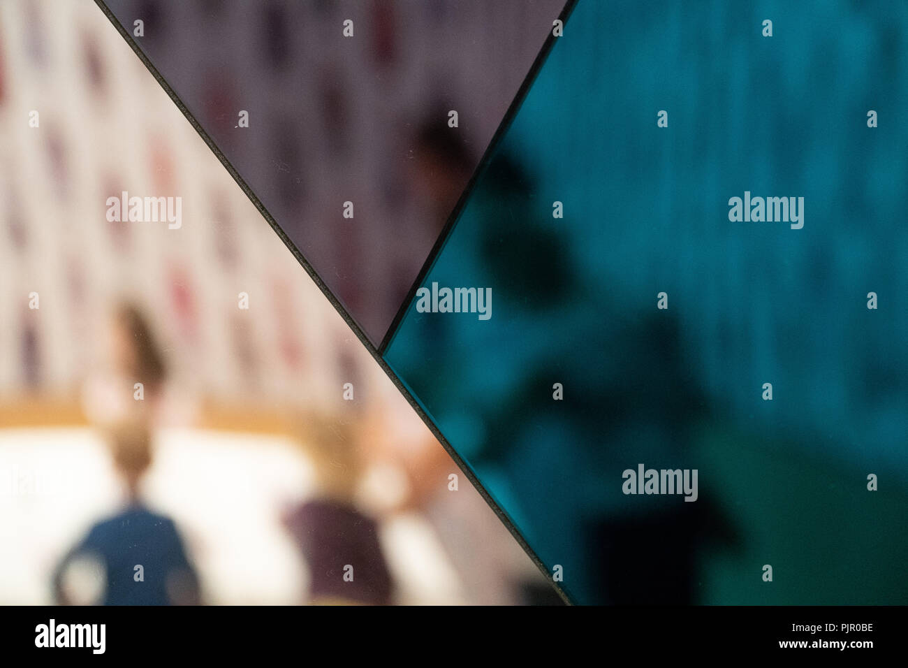 Three subdivided glass forms in different colours Stock Photo - Alamy