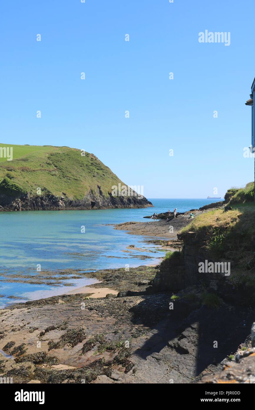 Rocky shore at Robert's Cove, Cork Stock Photo - Alamy
