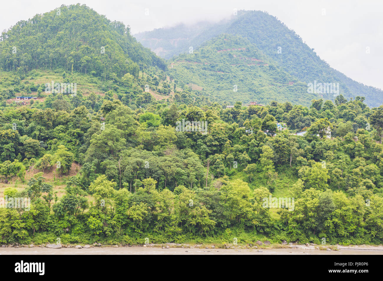 Scenery of beautiful Nepali rural village with mountains and green ...