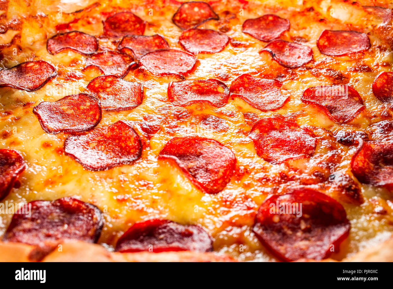 Appetizing background pepperoni pizza closeup filling the frame Stock ...