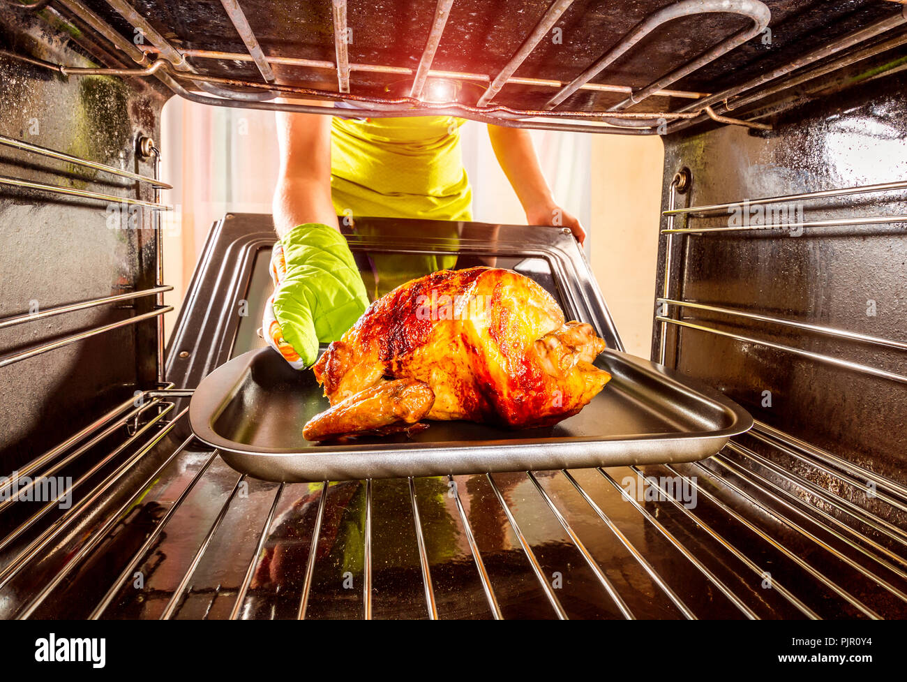 Woman cooking chicken kitchen hi-res stock photography and images - Alamy
