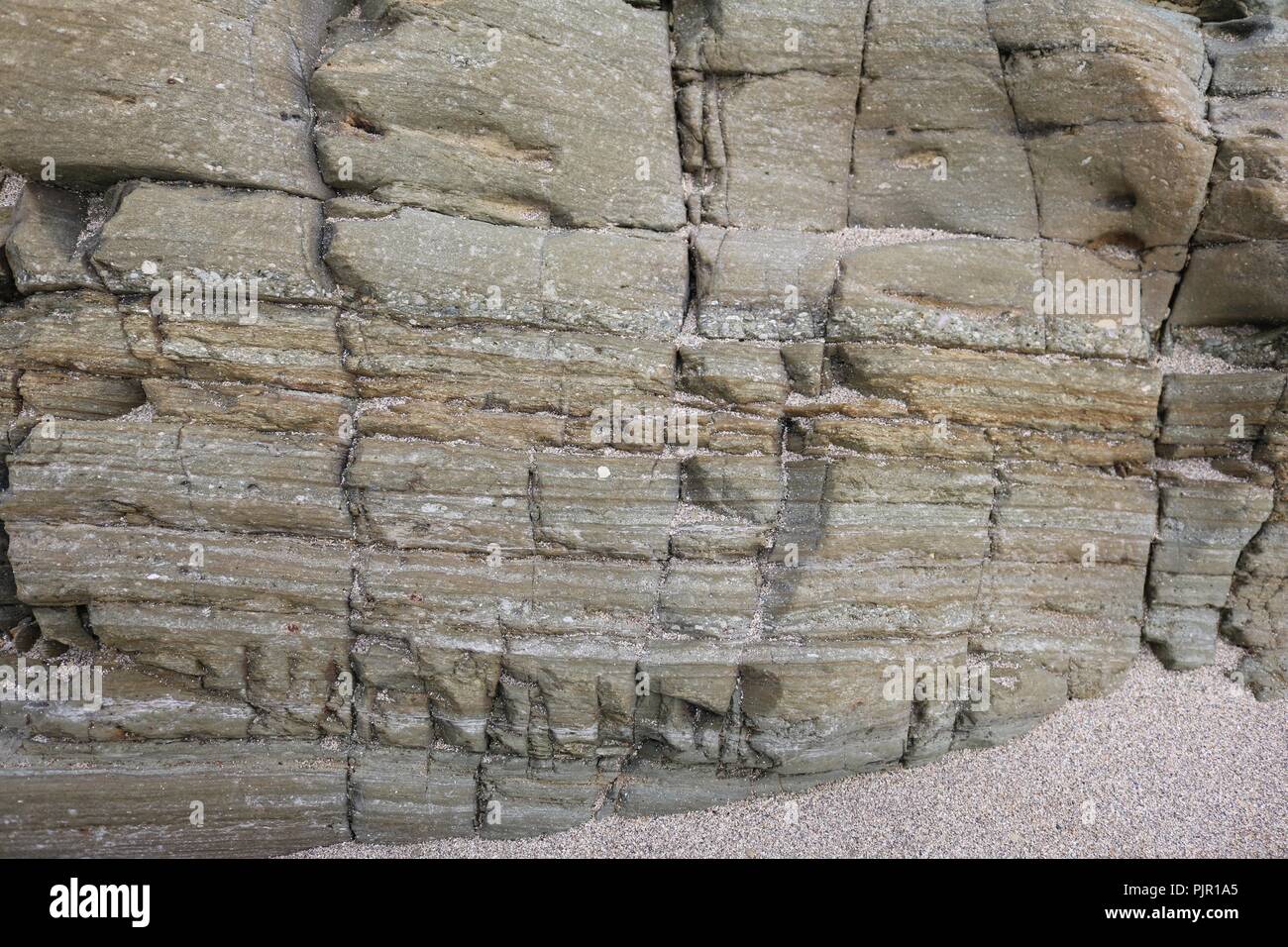 Marine sandstone interbedded with volcanic deposits at Ferriter's Cove ...