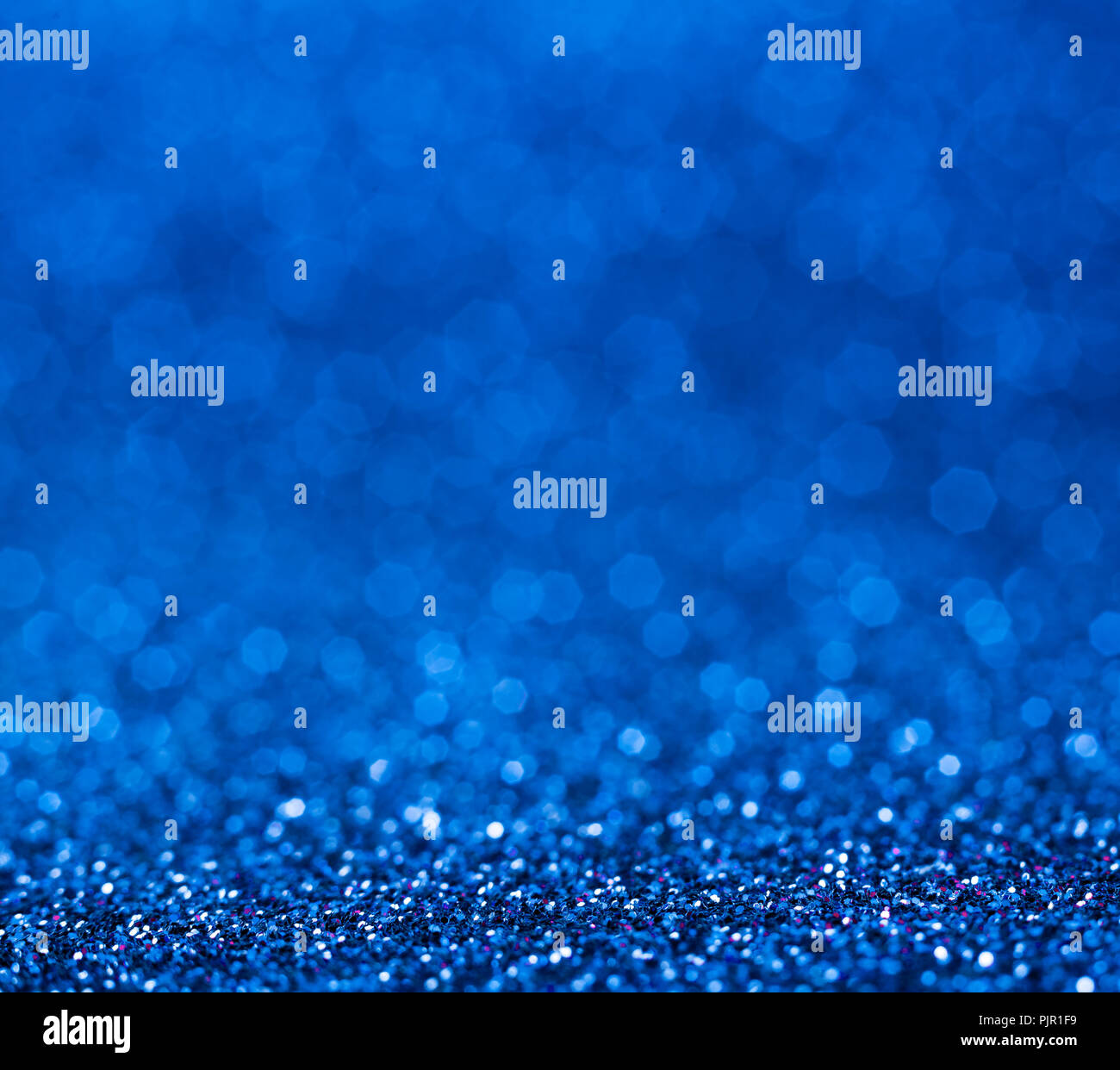 Shiny blue abstract christmas background. Blue glitter Stock Photo - Alamy