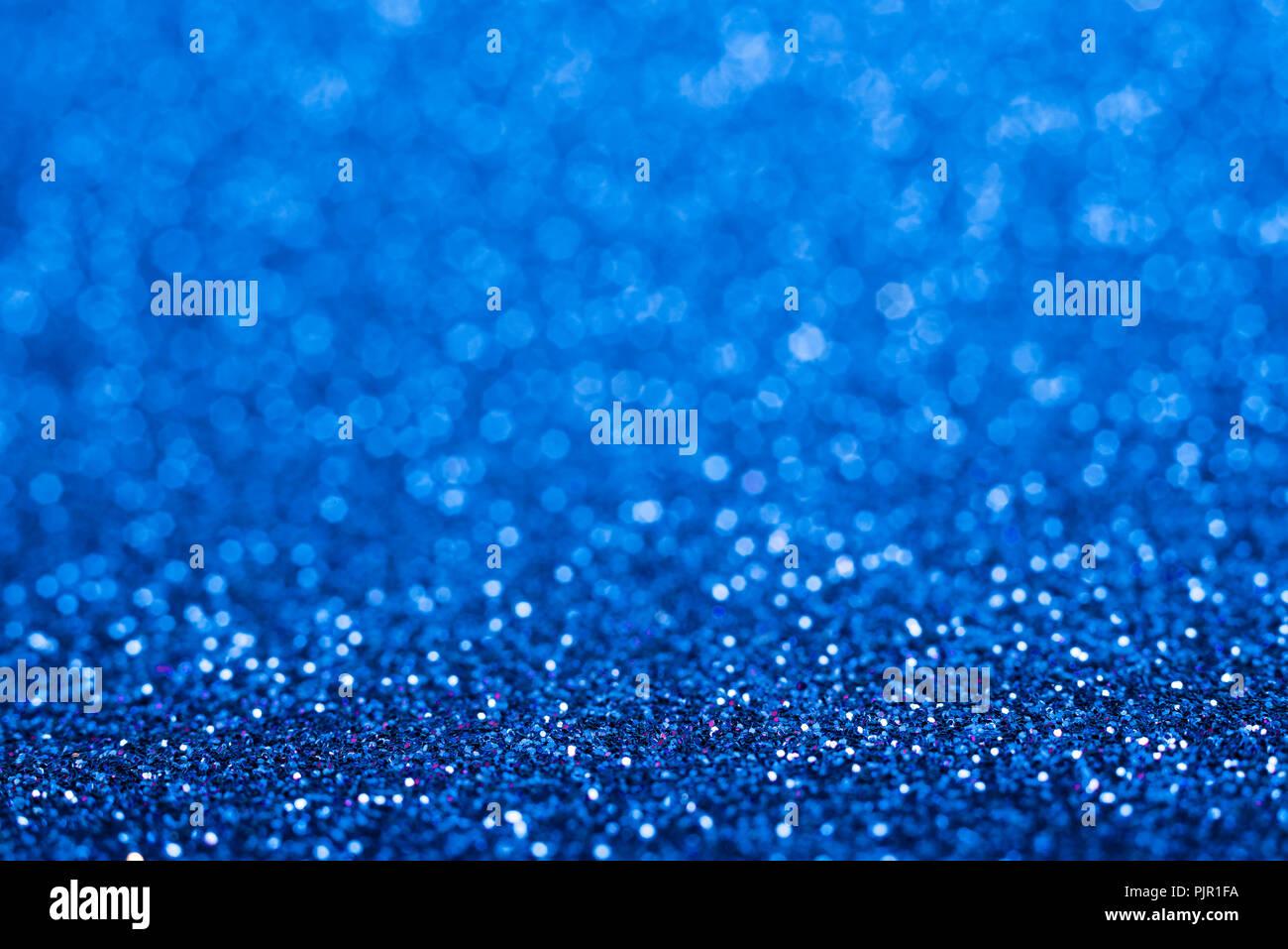 Shiny blue abstract christmas background. Blue glitter Stock Photo - Alamy